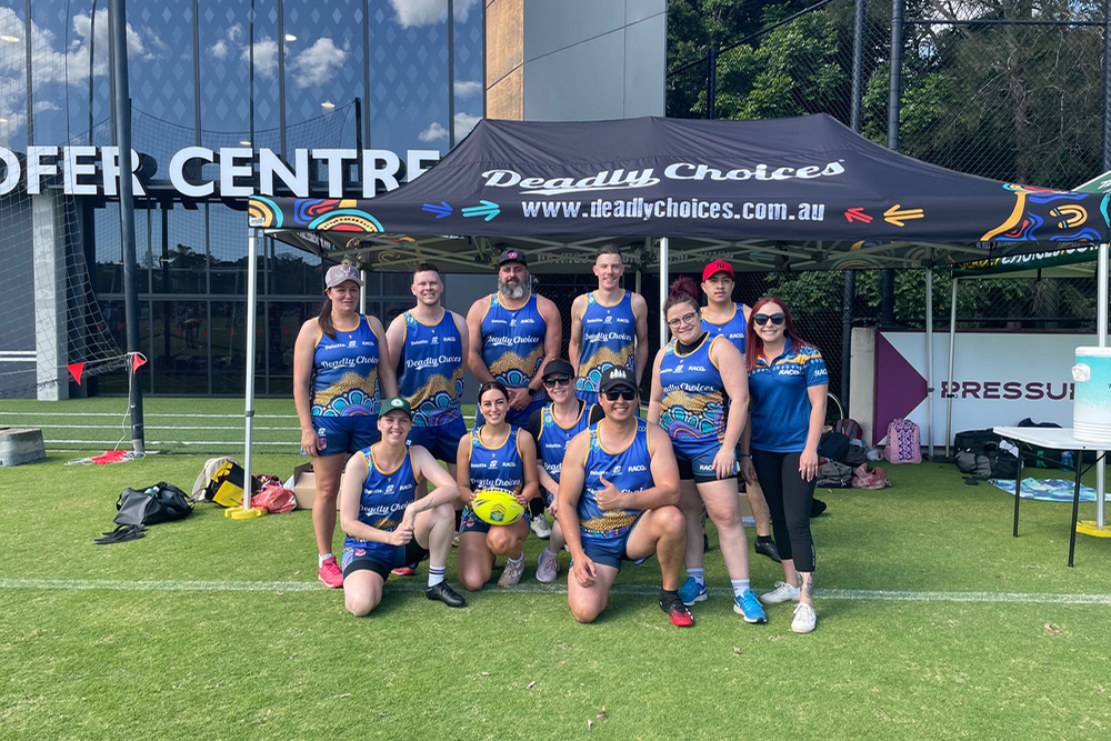 RACQ employees take to the footy field for Indigenous health | RACQ
